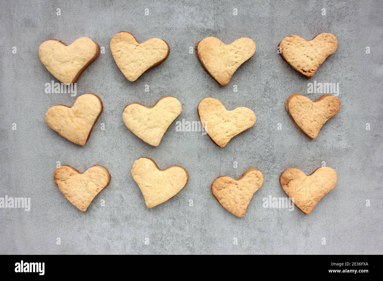 Homemade heart shaped cookies on a gray concrete background. Valentines ...