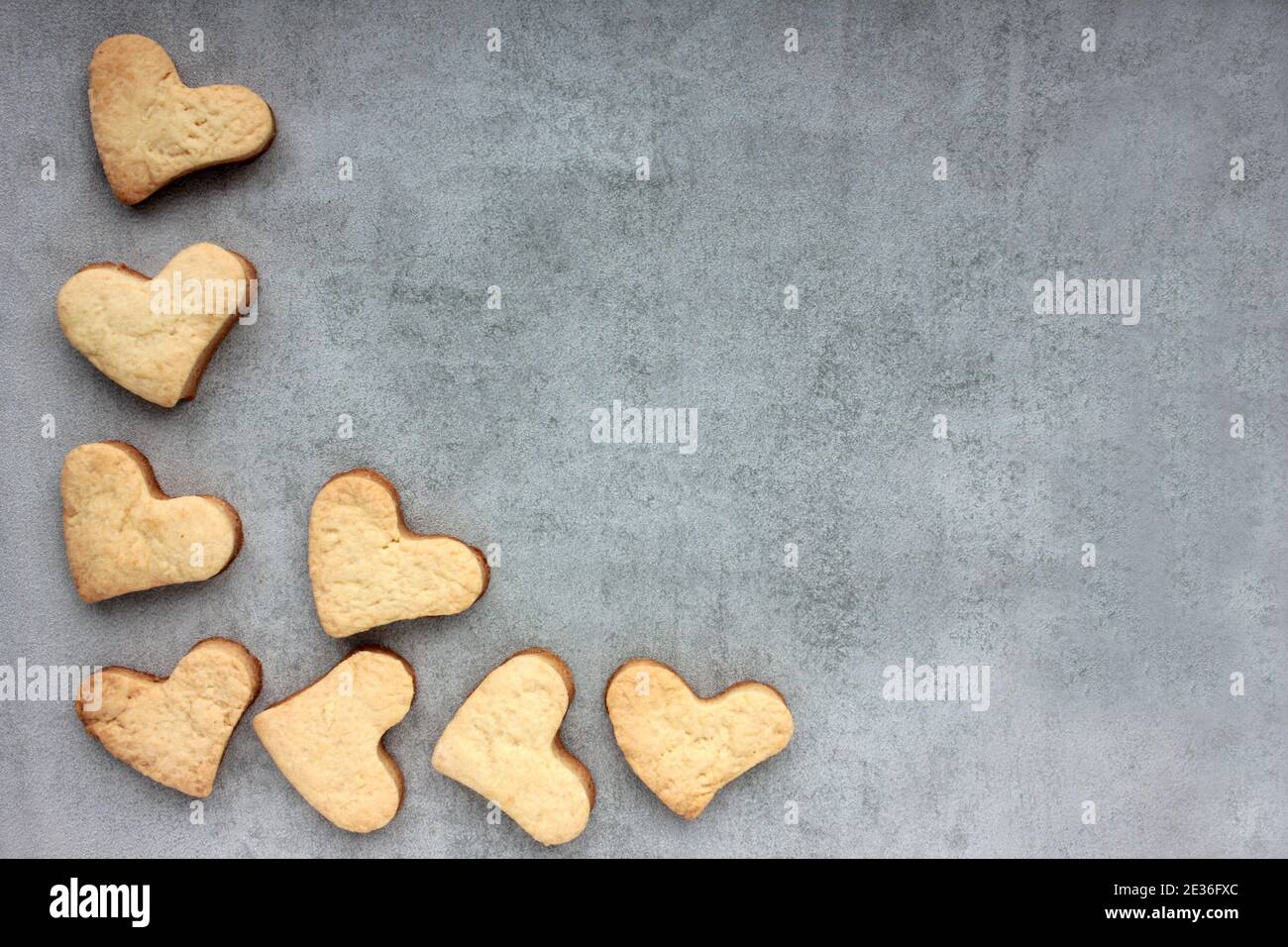 Homemade heart shaped cookies on a gray concrete background. Valentines ...