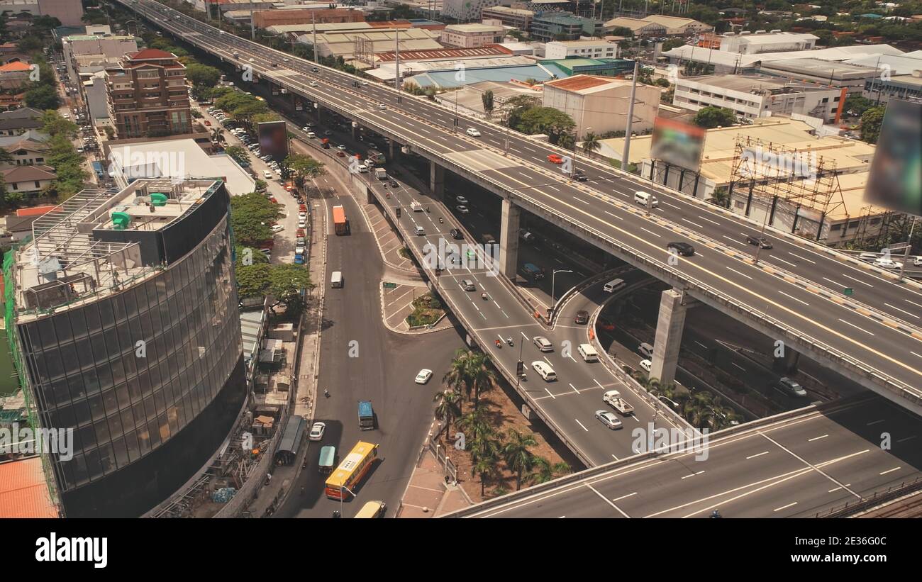 Manila cityscape at road with cars, trucks. Modern buildings aerial ...
