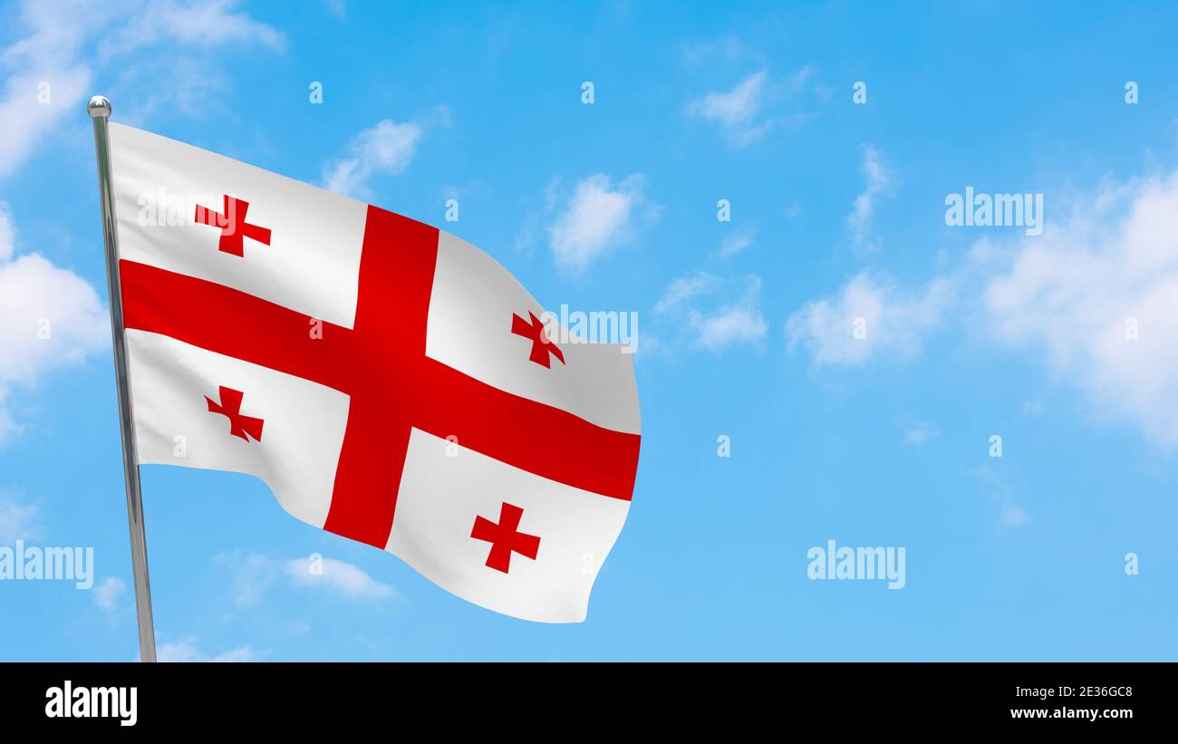 Georgia flag on pole. Blue sky. National flag of Georgia Stock Photo ...