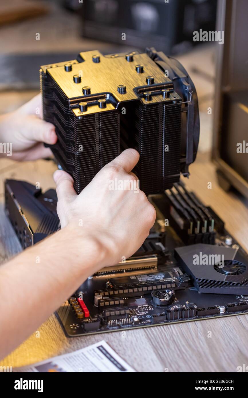 Installing a processor fan on the computer motherboard. Computer repair ...