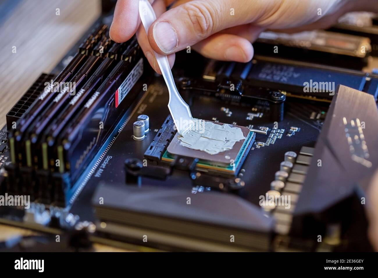 Moscow, Russia -25 Dec 2020: Applying thermal paste to the CPU of a ...