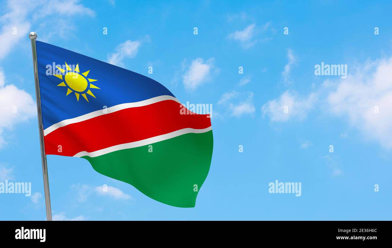 Namibia flag on pole. Blue sky. National flag of Namibia Stock Photo ...