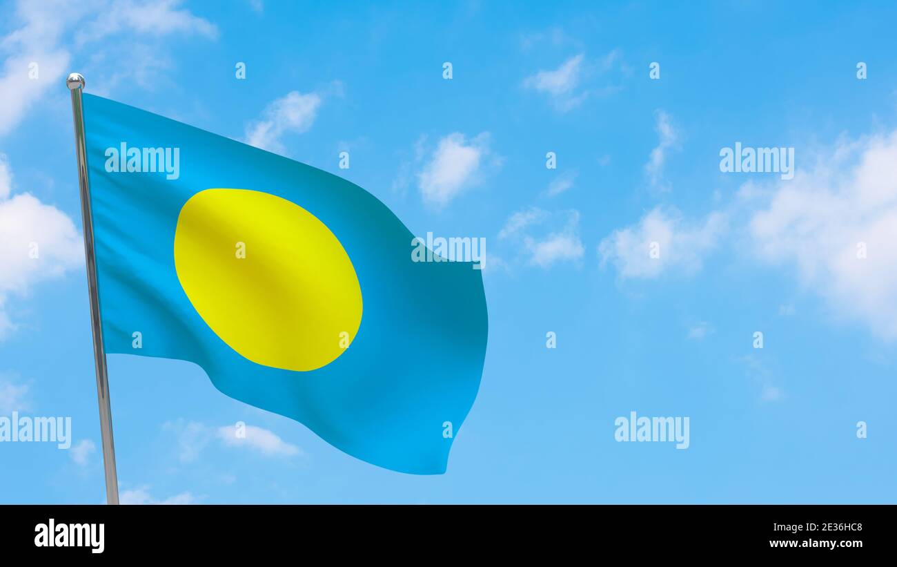 Palau flag on pole. Blue sky. National flag of Palau Stock Photo - Alamy