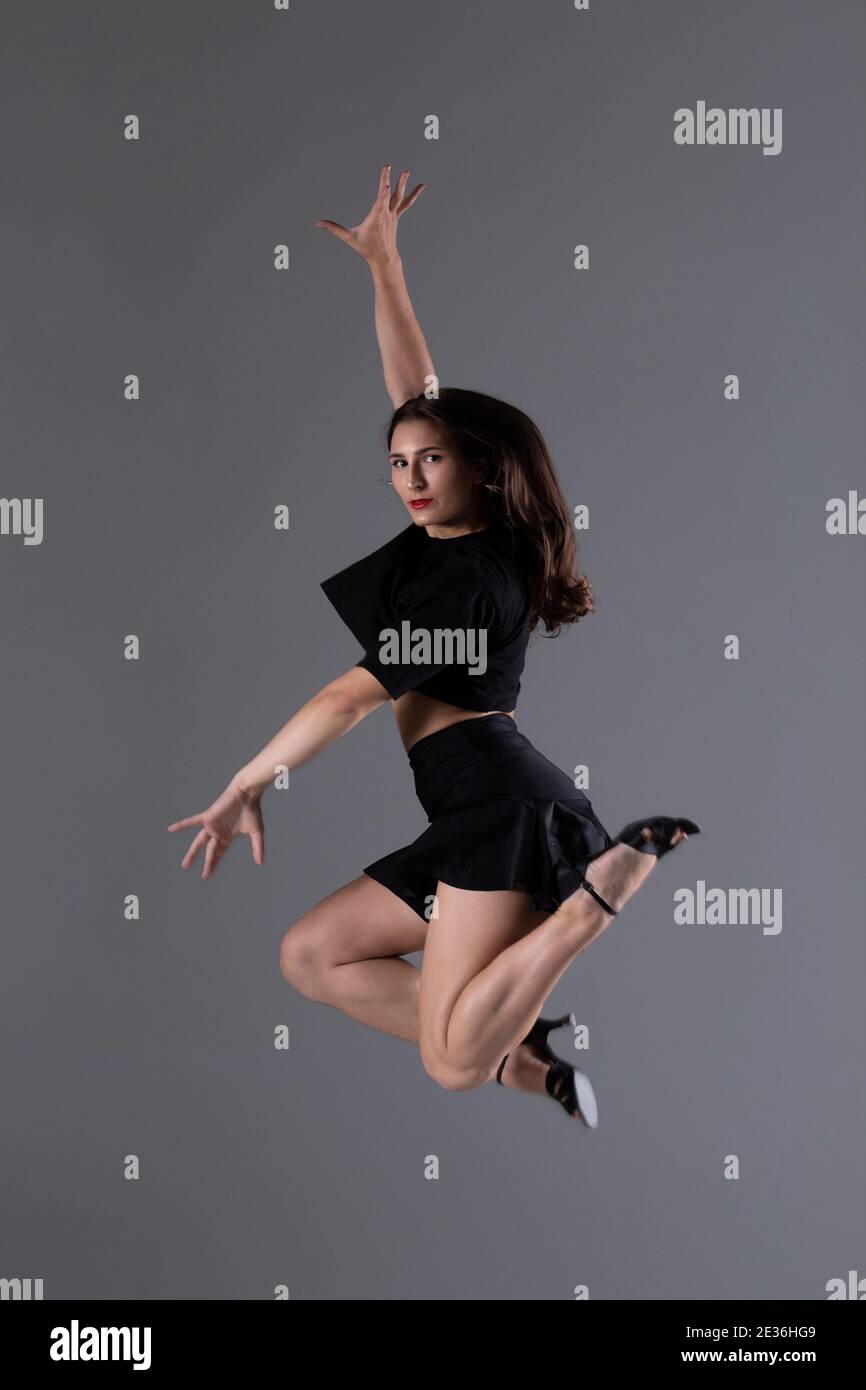 cool looking dancer makes a difficult jump , dancer Stock Photo - Alamy