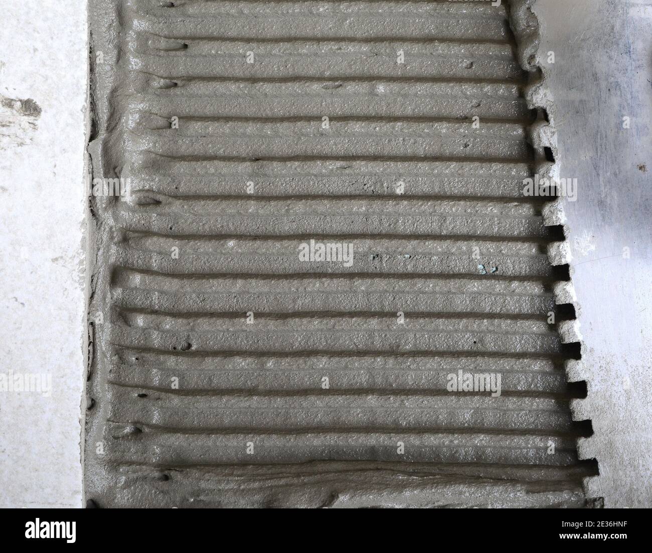 Fresh concrete tehture. Wet mortar surface. Lined grey concrete as ...