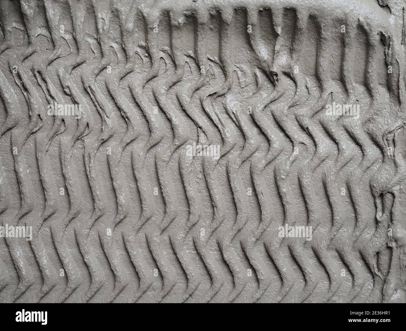 Fresh concrete tehture. Wet mortar surface. Lined grey concrete as ...