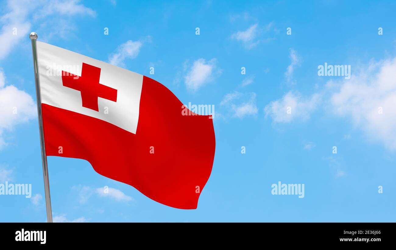 Tonga flag on pole. Blue sky. National flag of Tonga Stock Photo - Alamy