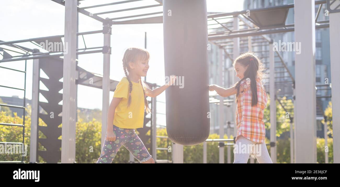 Kids having fun on the playground Stock Photo - Alamy