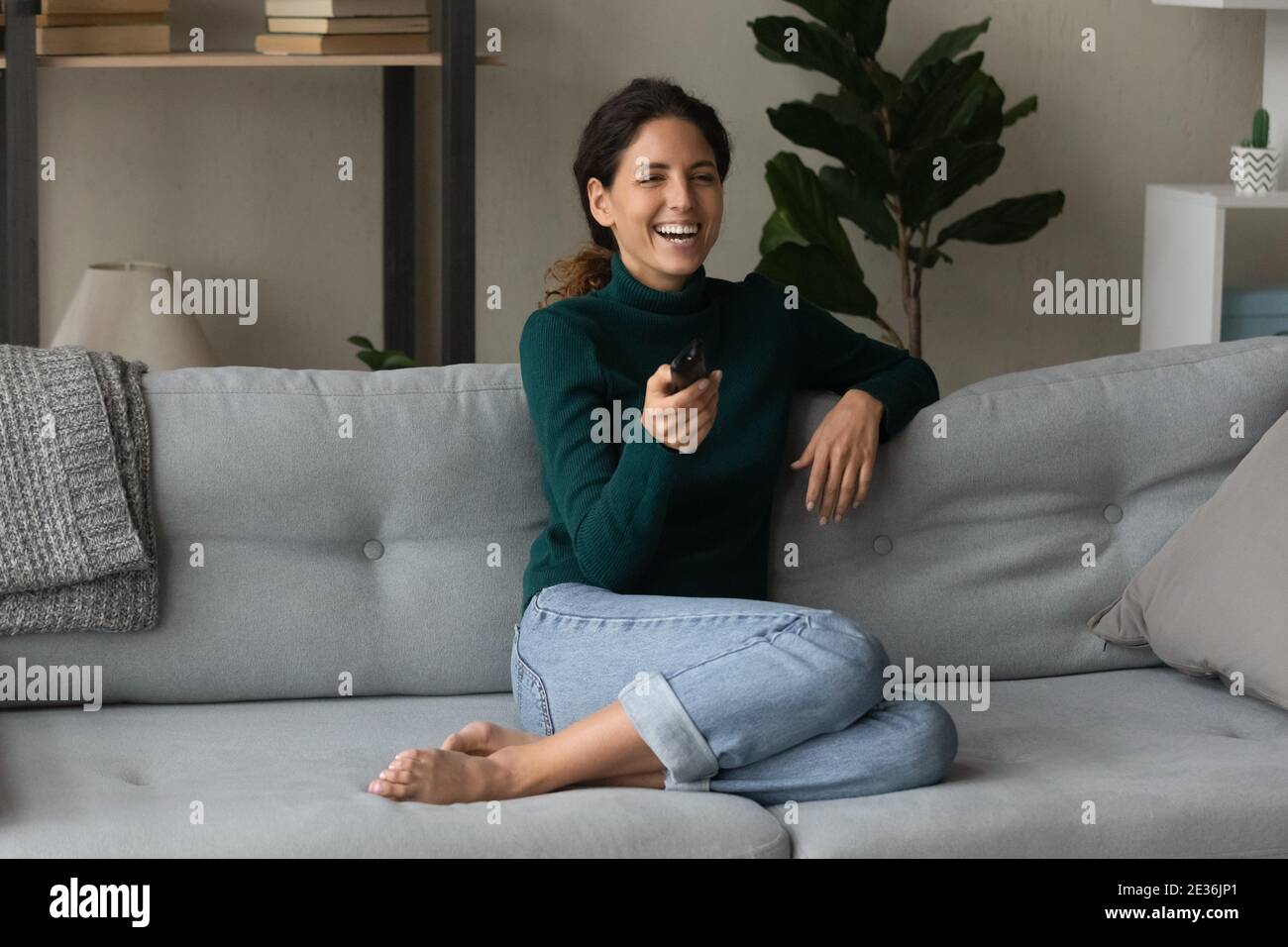 Female television lazy hi-res stock photography and images - Alamy