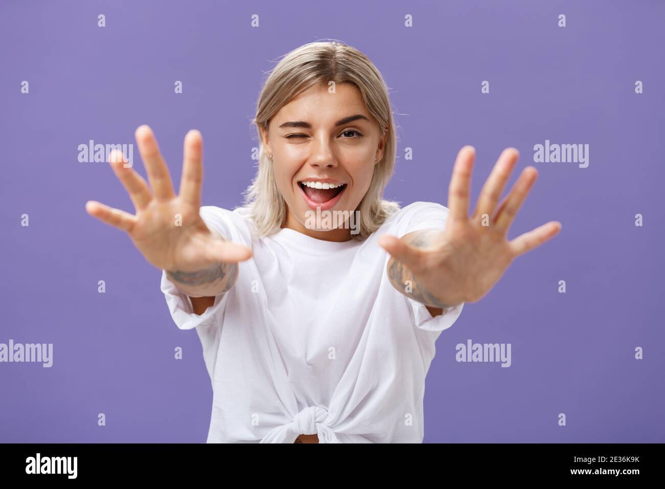 Reaching To You Portrait Of Flirty Good Looking And Confident Stylish