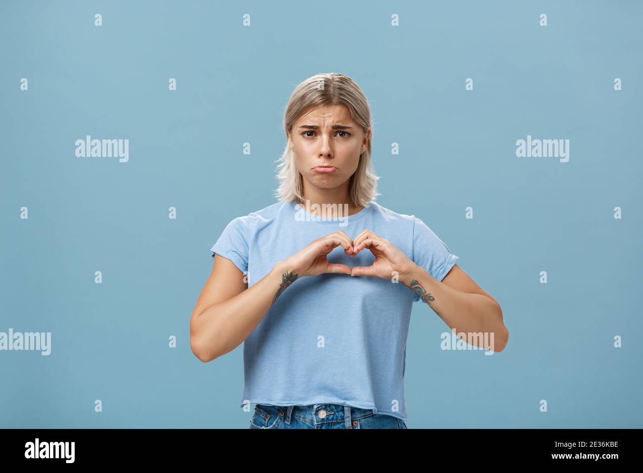Heart being broken. Sad and gloomy heartbroken girl with blond hair ...