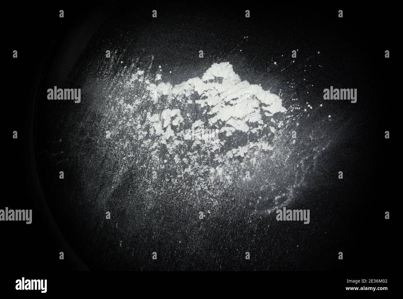White powder isolated on black background. Abstract white powder ...