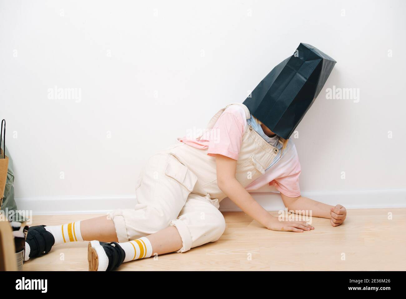 Young girl hid from the problems by putting a bag over her head Stock ...