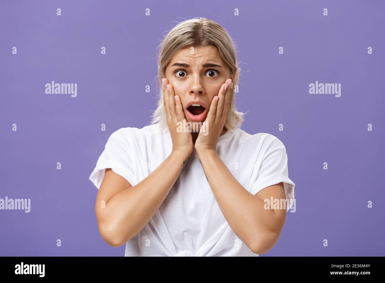 Shocked and worried silly european woman expressing empathy feeling ...