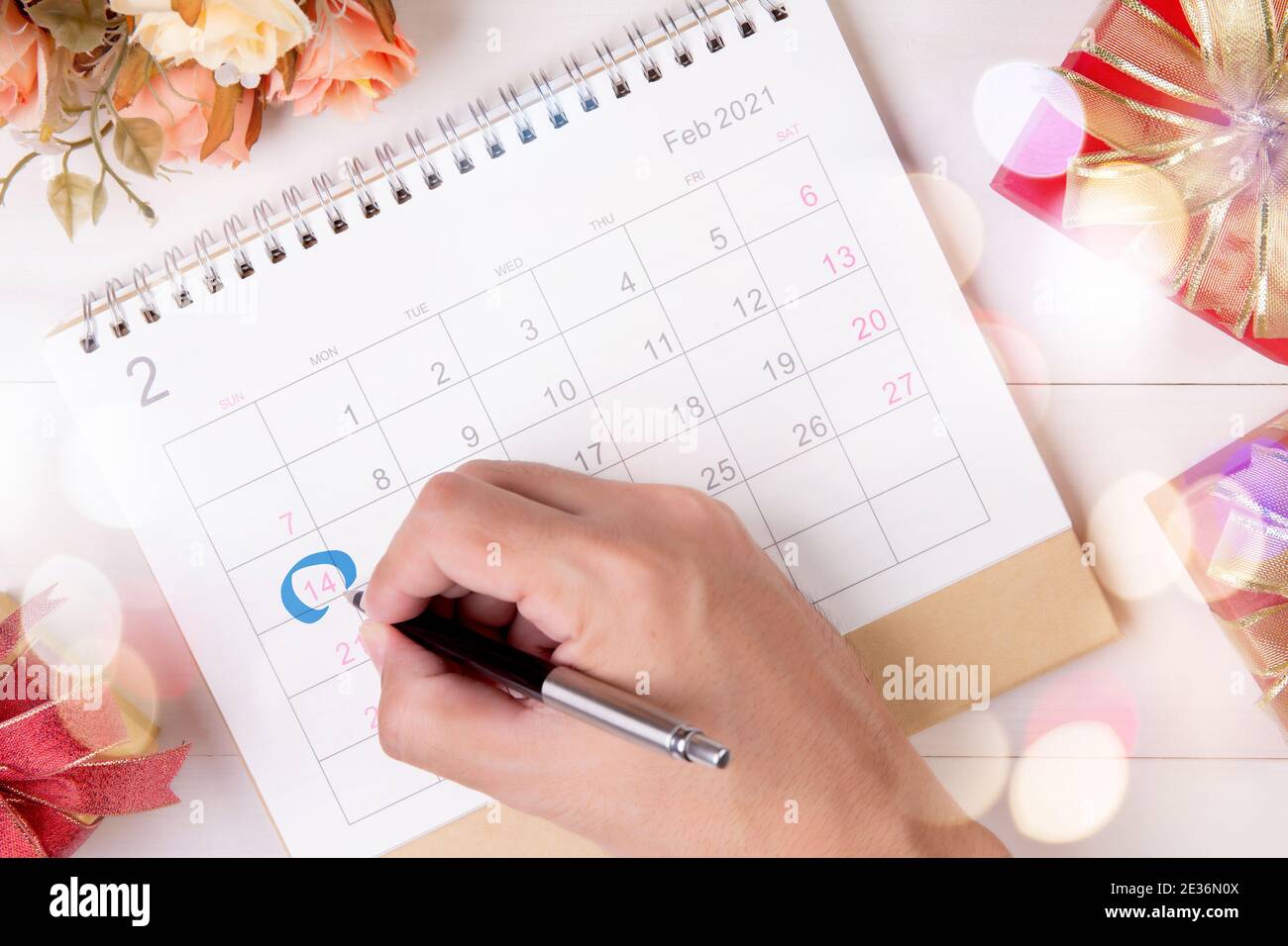 Hand writing with marker on calendar reminder with memo 14 February ...