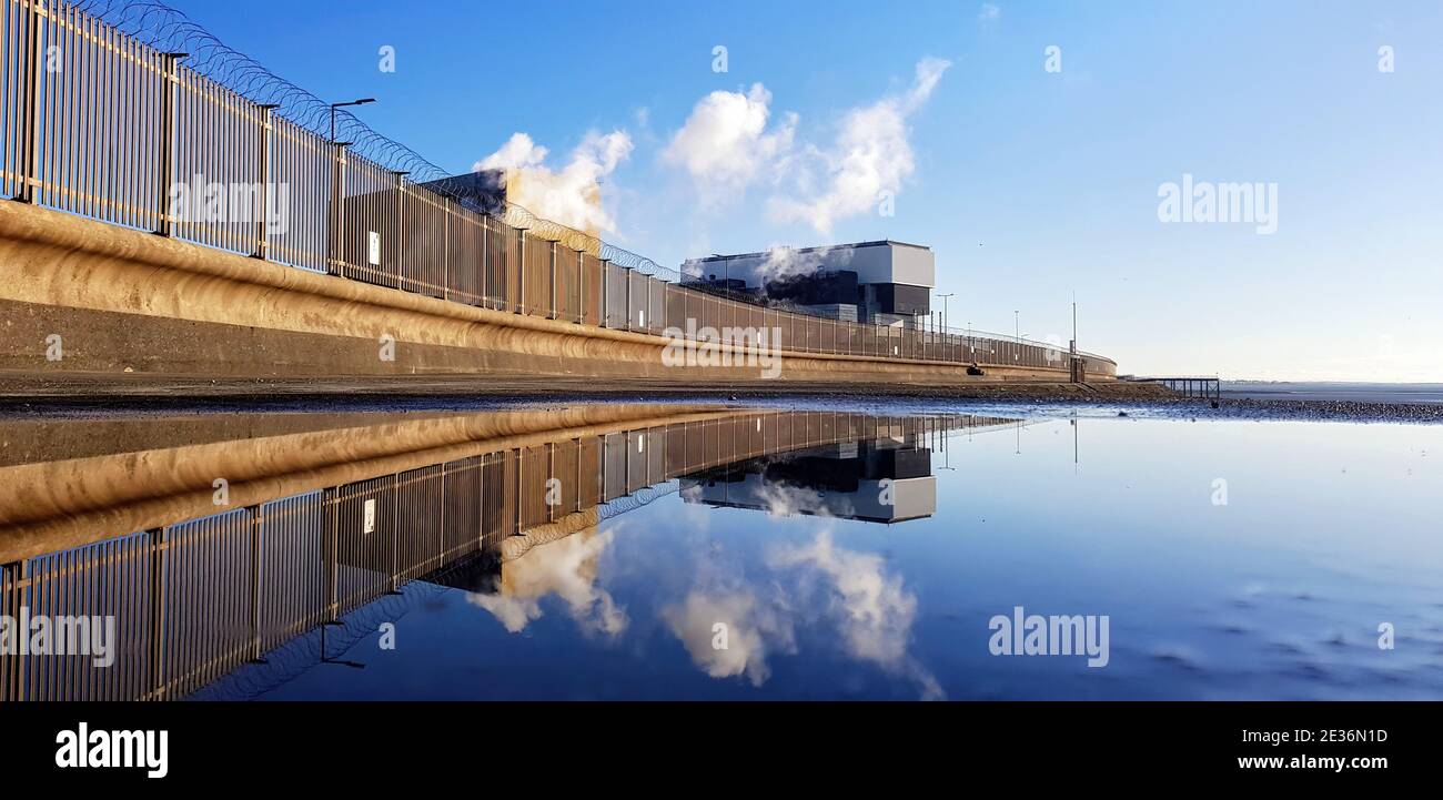 Heysham nuclear power station reflected in a puddle Stock Photo - Alamy