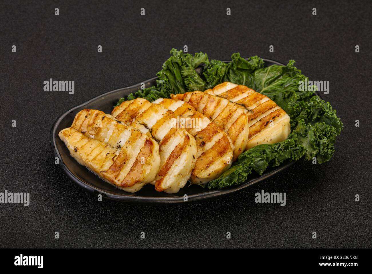 Grilled Greek haloumi cheese with herbs and spices Stock Photo - Alamy