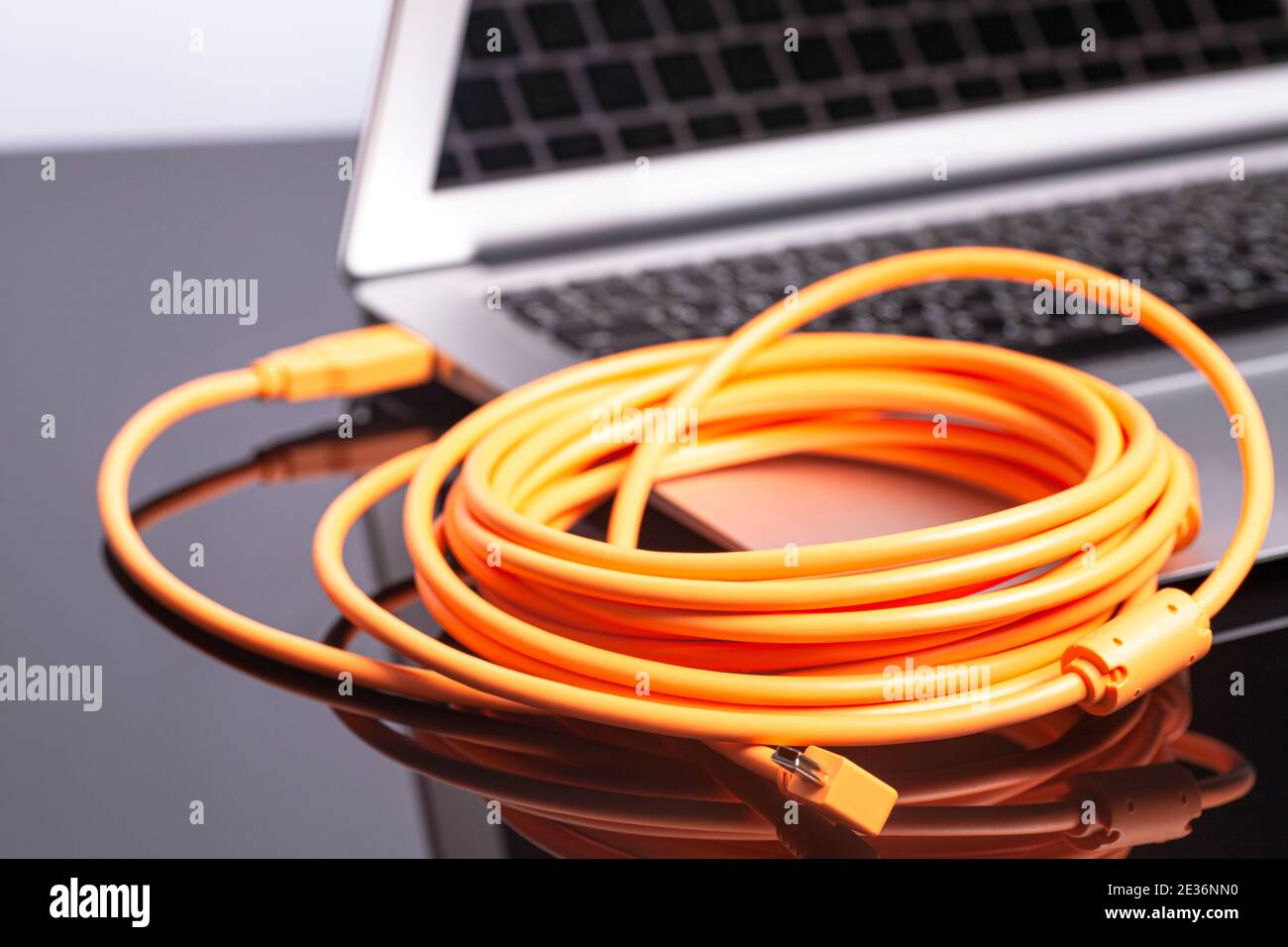 Camera connected to laptop with cable hi-res stock photography and ...
