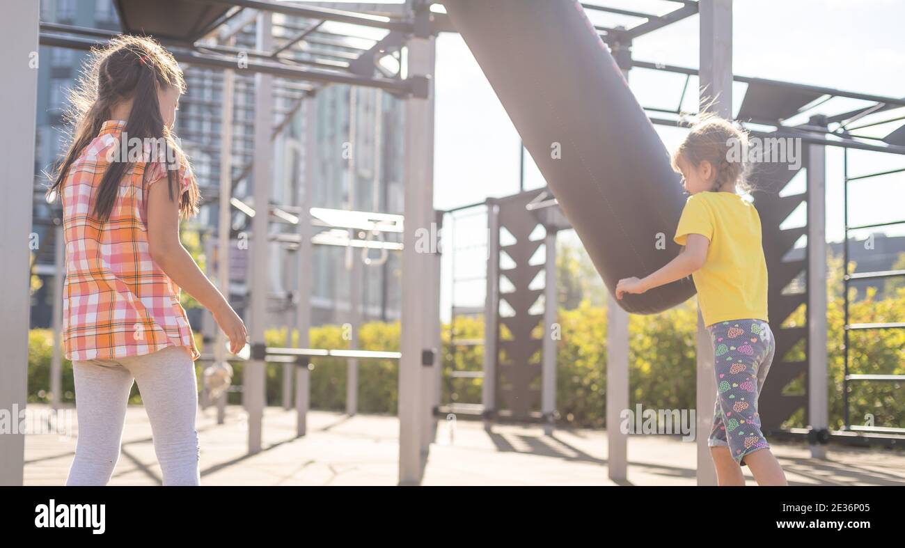 Kids having fun on the playground Stock Photo - Alamy
