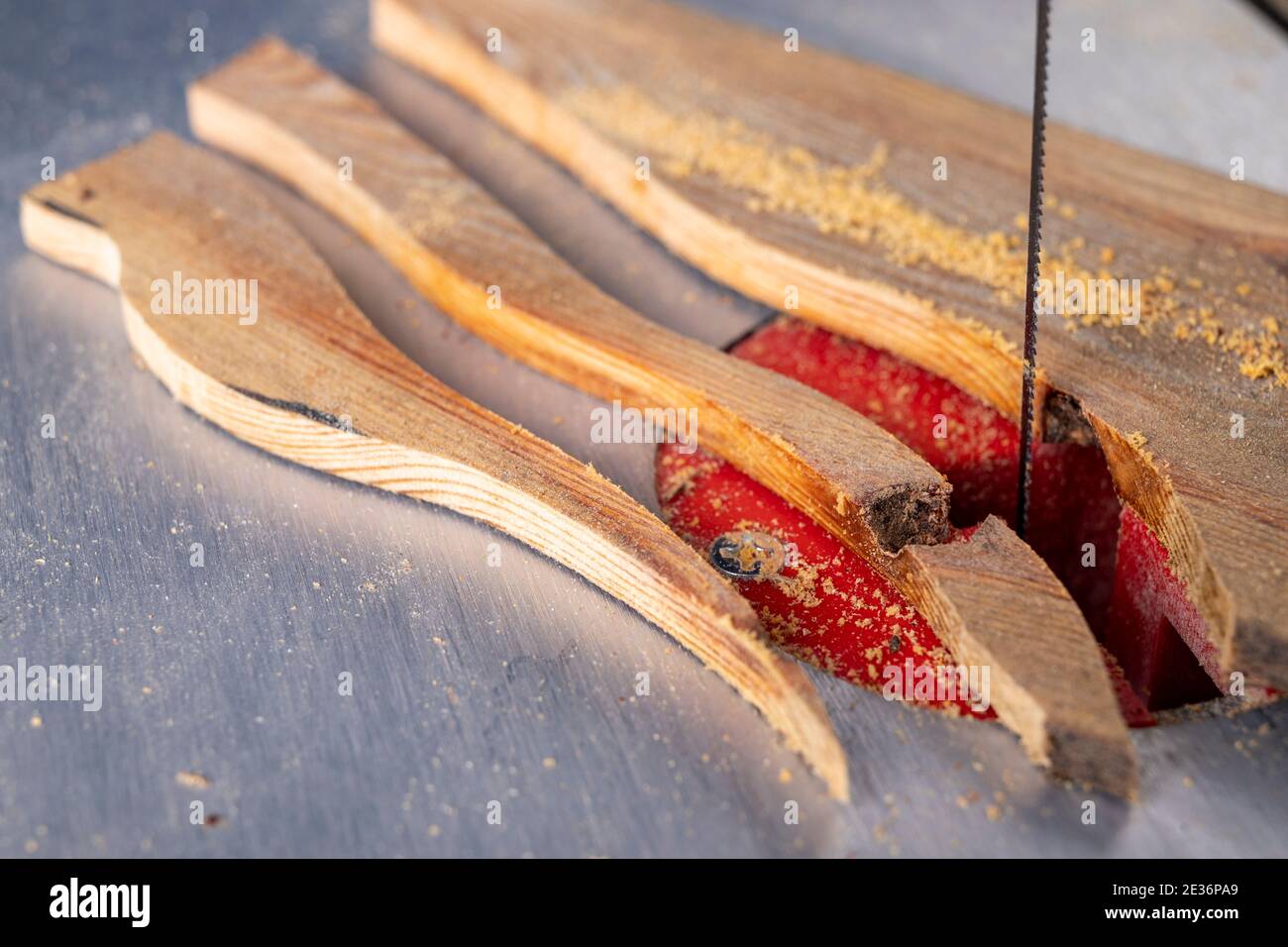 Cutting wood with a table jigsaw. Cutting complex shapes in a wooden ...