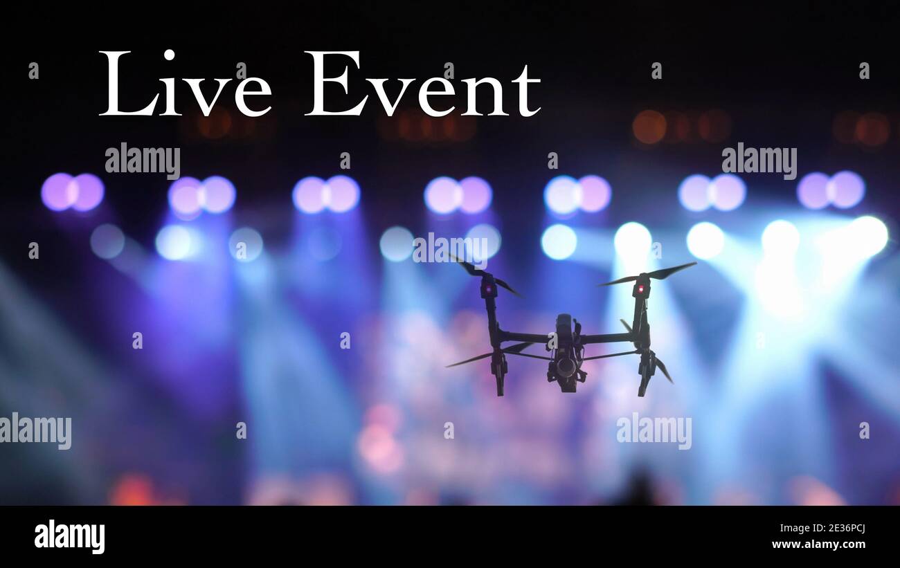 Closeup silhouette of Drone flying for taking video of Concert crowd ...