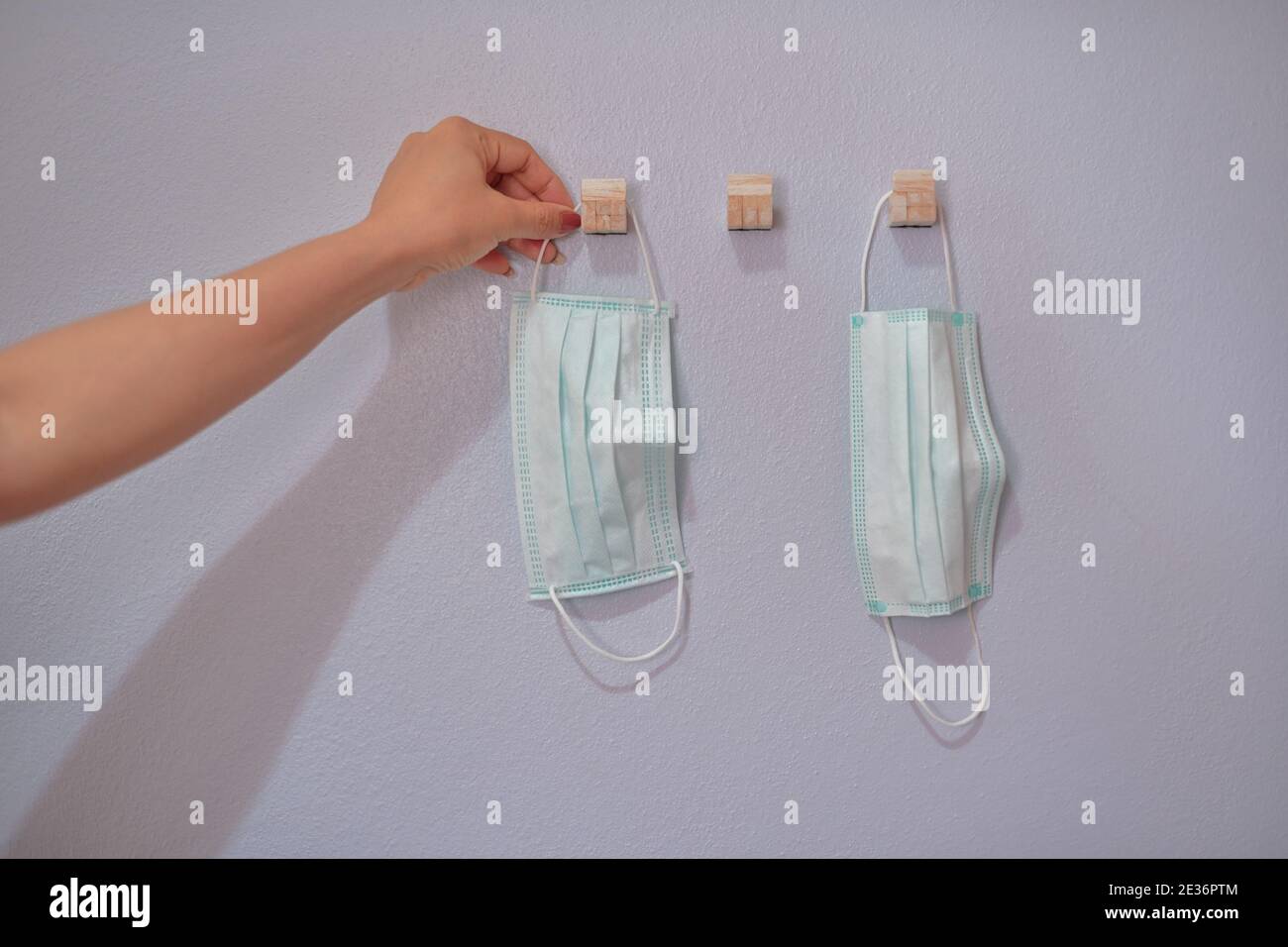 The surgical masks hanging on the wall Stock Photo - Alamy