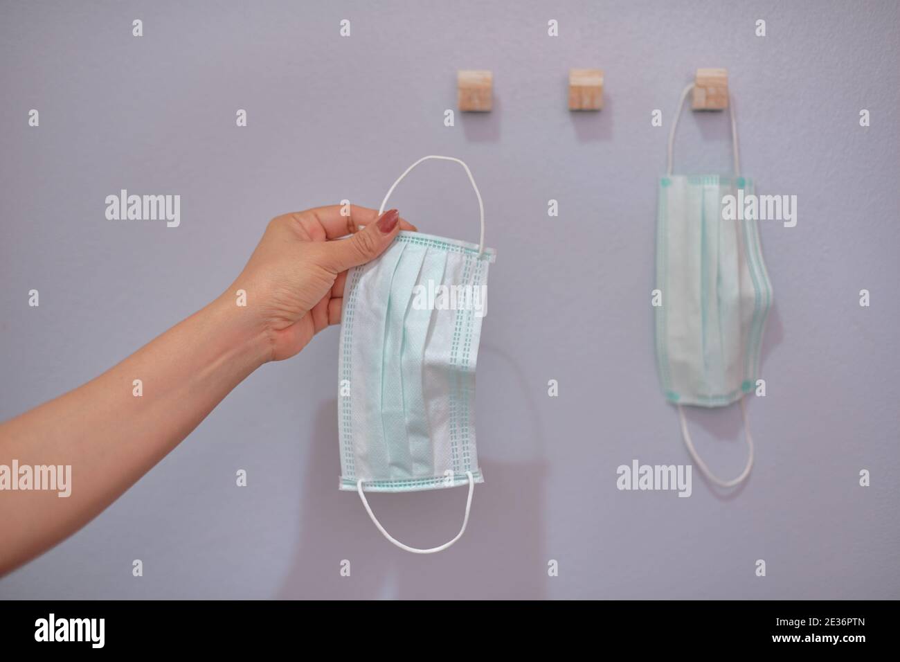 The surgical masks hanging on the wall Stock Photo - Alamy