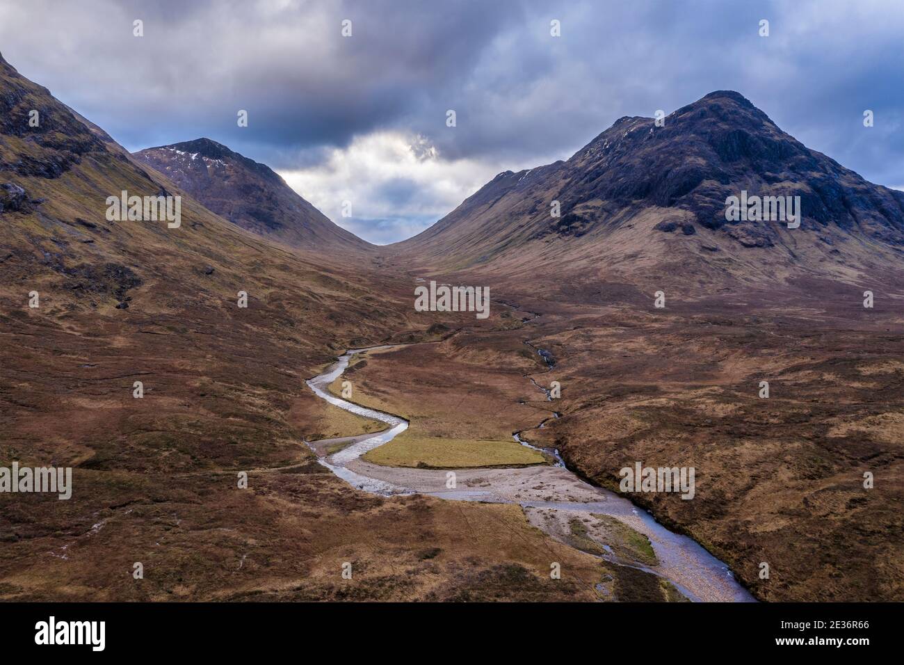 Flying drone dramatic landscape image of mountains rivers and valleys ...