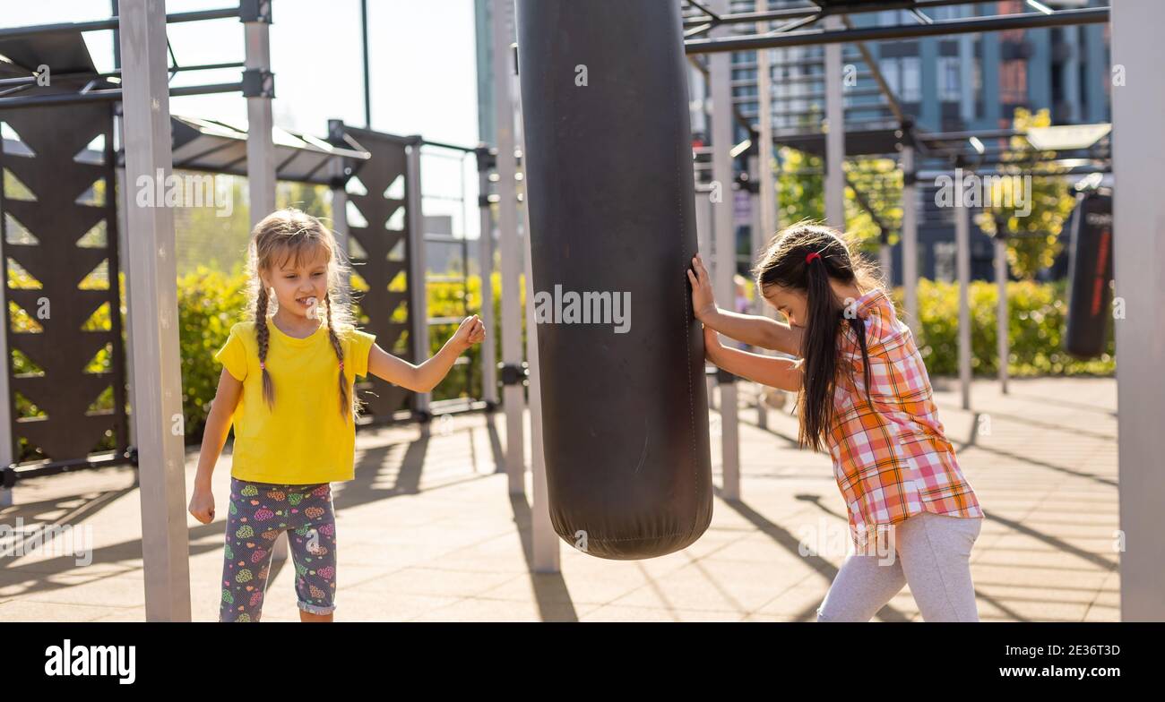 Kids having fun on the playground Stock Photo - Alamy
