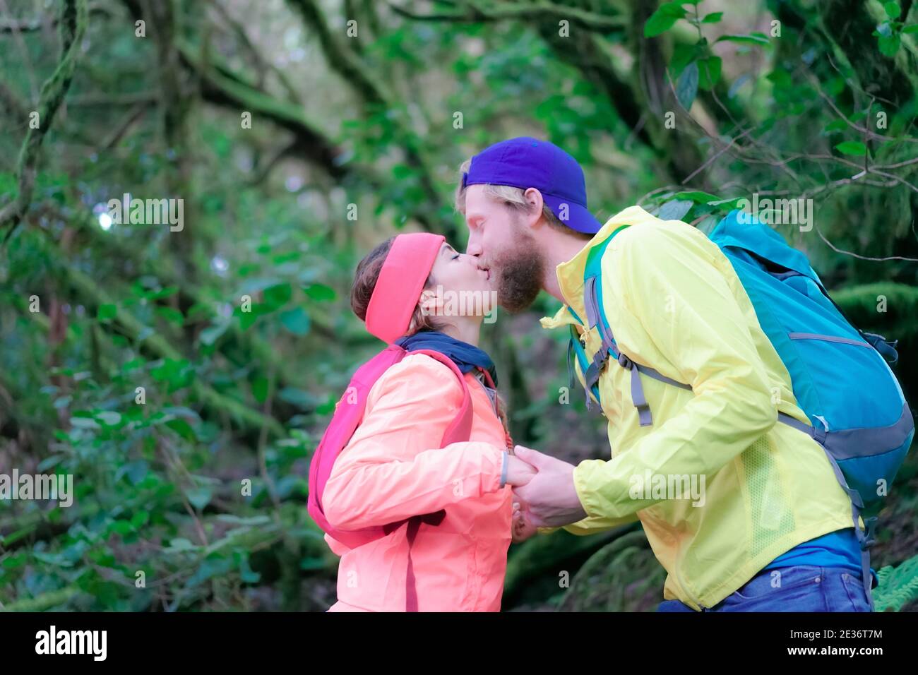 Beautiful couple enjoying nature. Love hikers in the forest, stopping ...