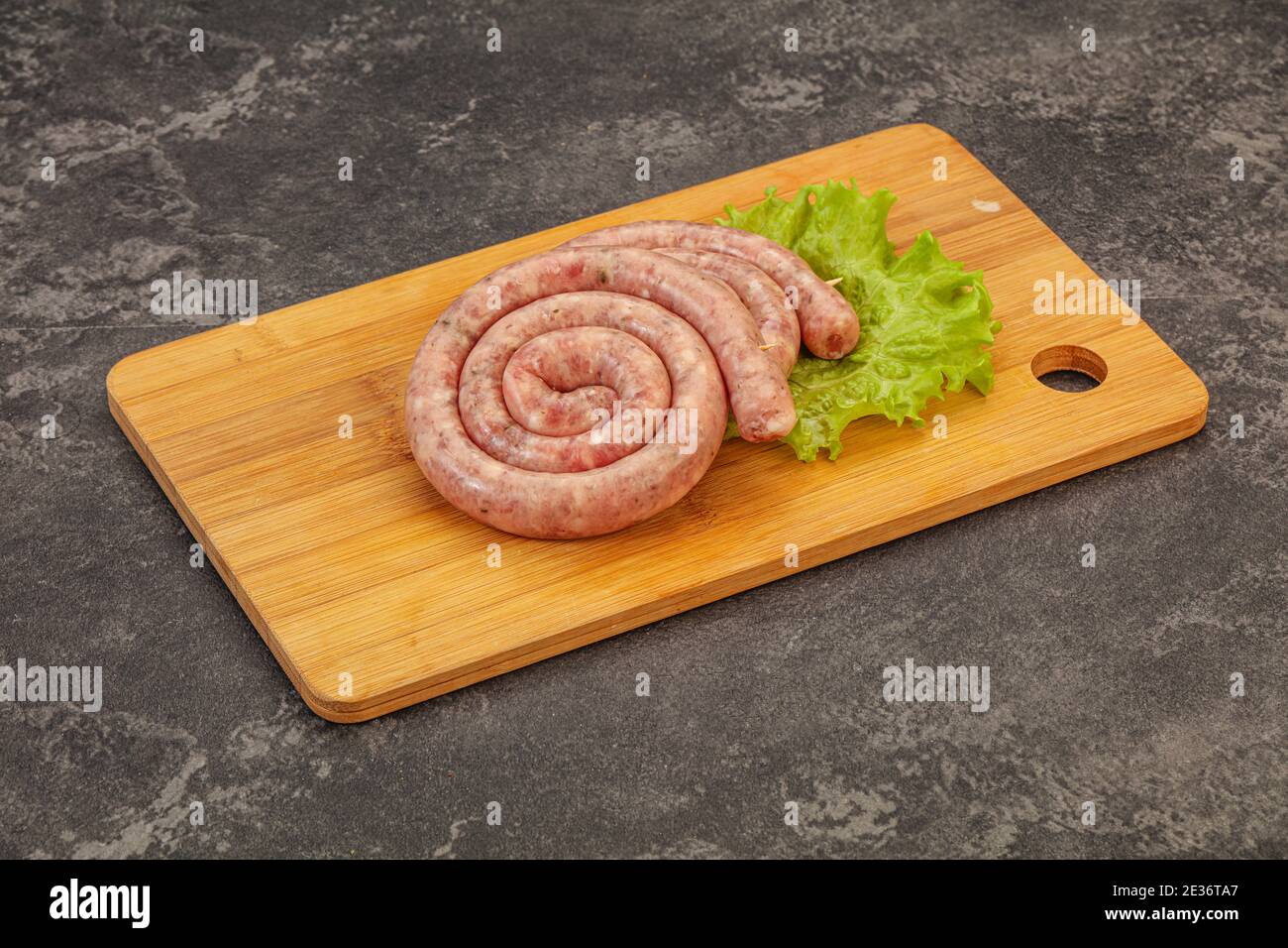 Raw pork sausage ring for grill Stock Photo - Alamy