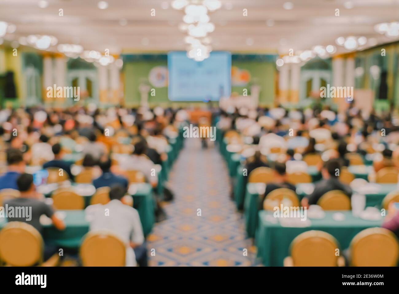 Abstract blurred photo of conference hall or seminar room with attendee ...