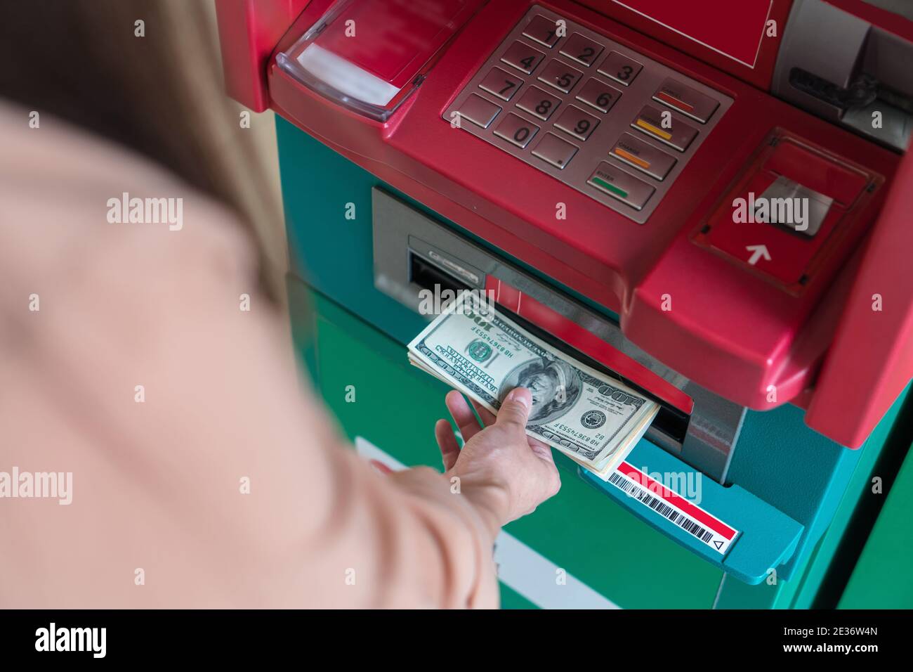 Top view of Closeup woman withdrawing the cash via ATM, business ...