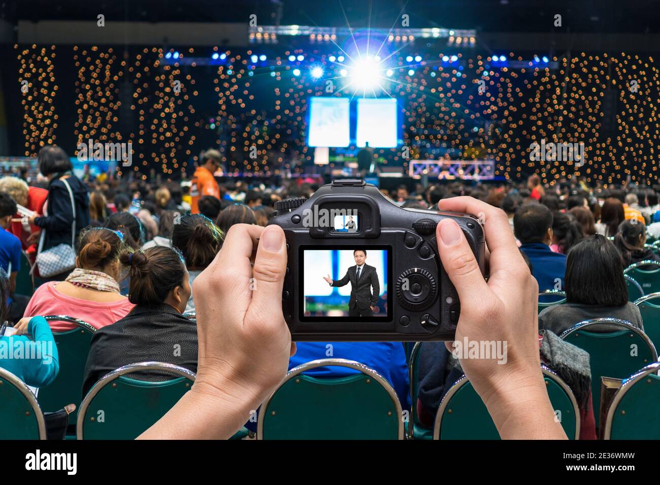 Hand holding the camera taking photograph to the businessman on the ...