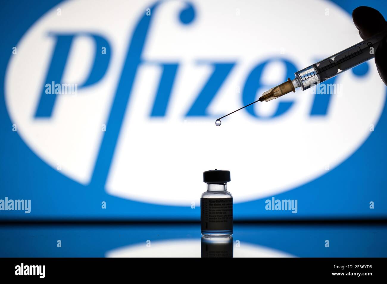 Poland. 15th Jan, 2021. In this photo illustration a syringe and a vial ...