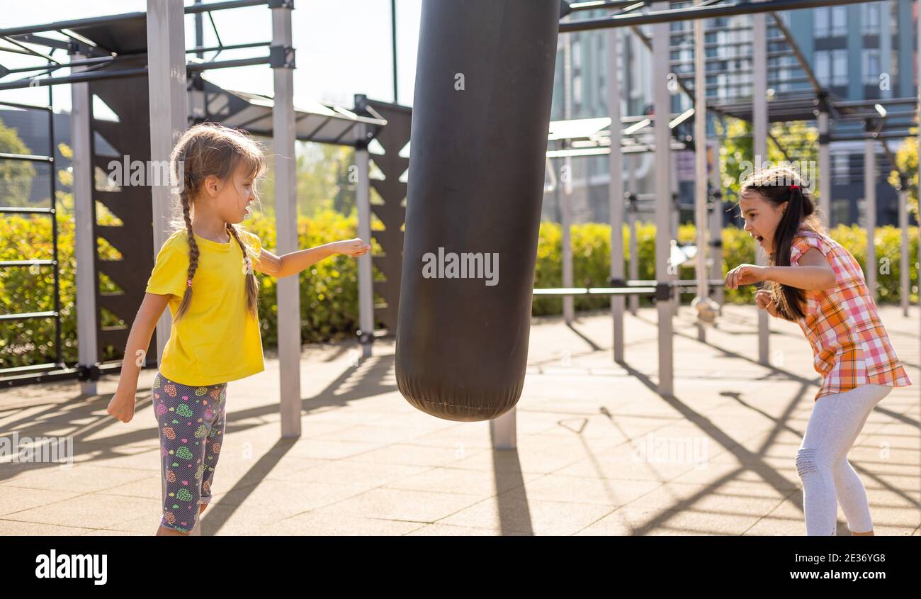 Kids having fun on the playground Stock Photo - Alamy