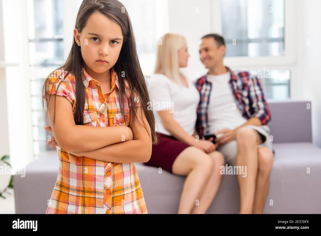 Sad girl hearing parents arguing hi-res stock photography and images ...