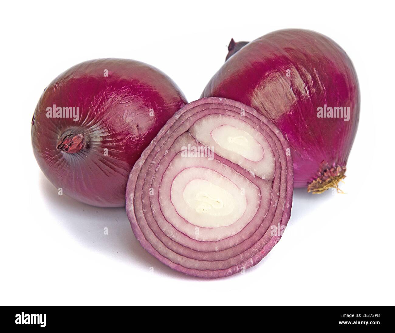 Three Onions isolated on white background Stock Photo - Alamy