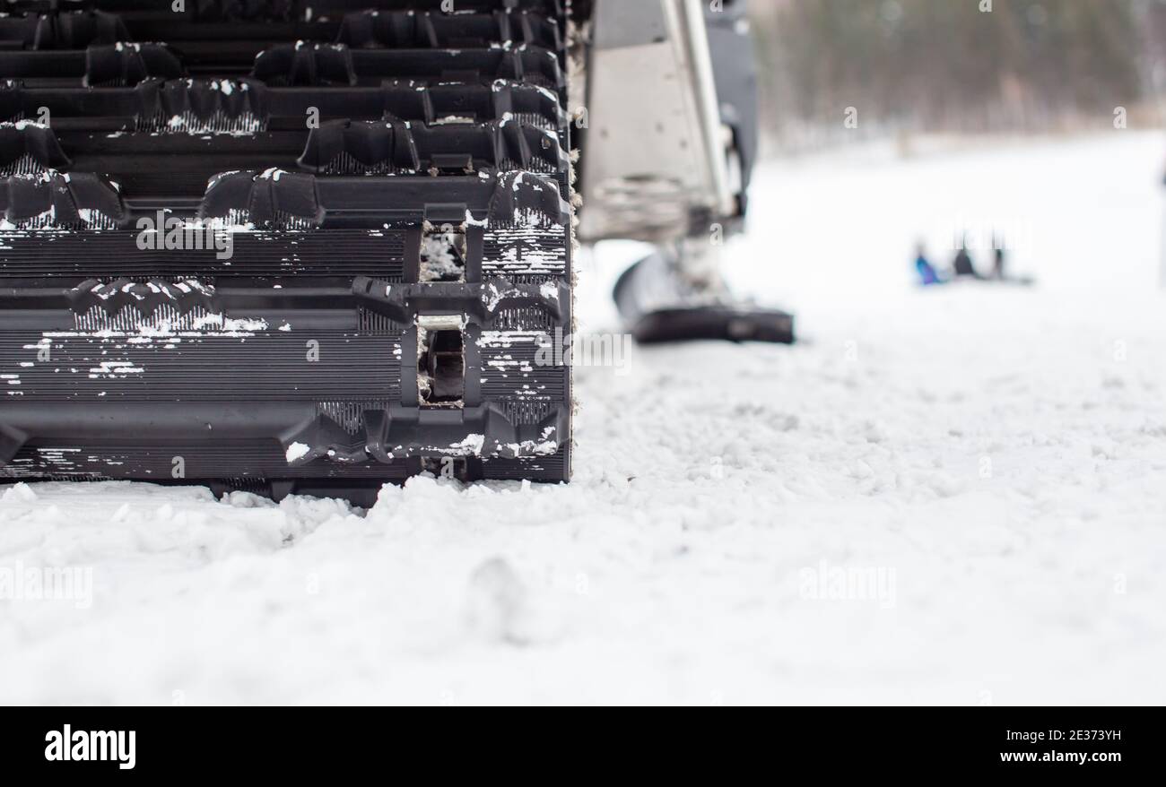 The back of the snowmobile in winter. Riding in the snow on a ...