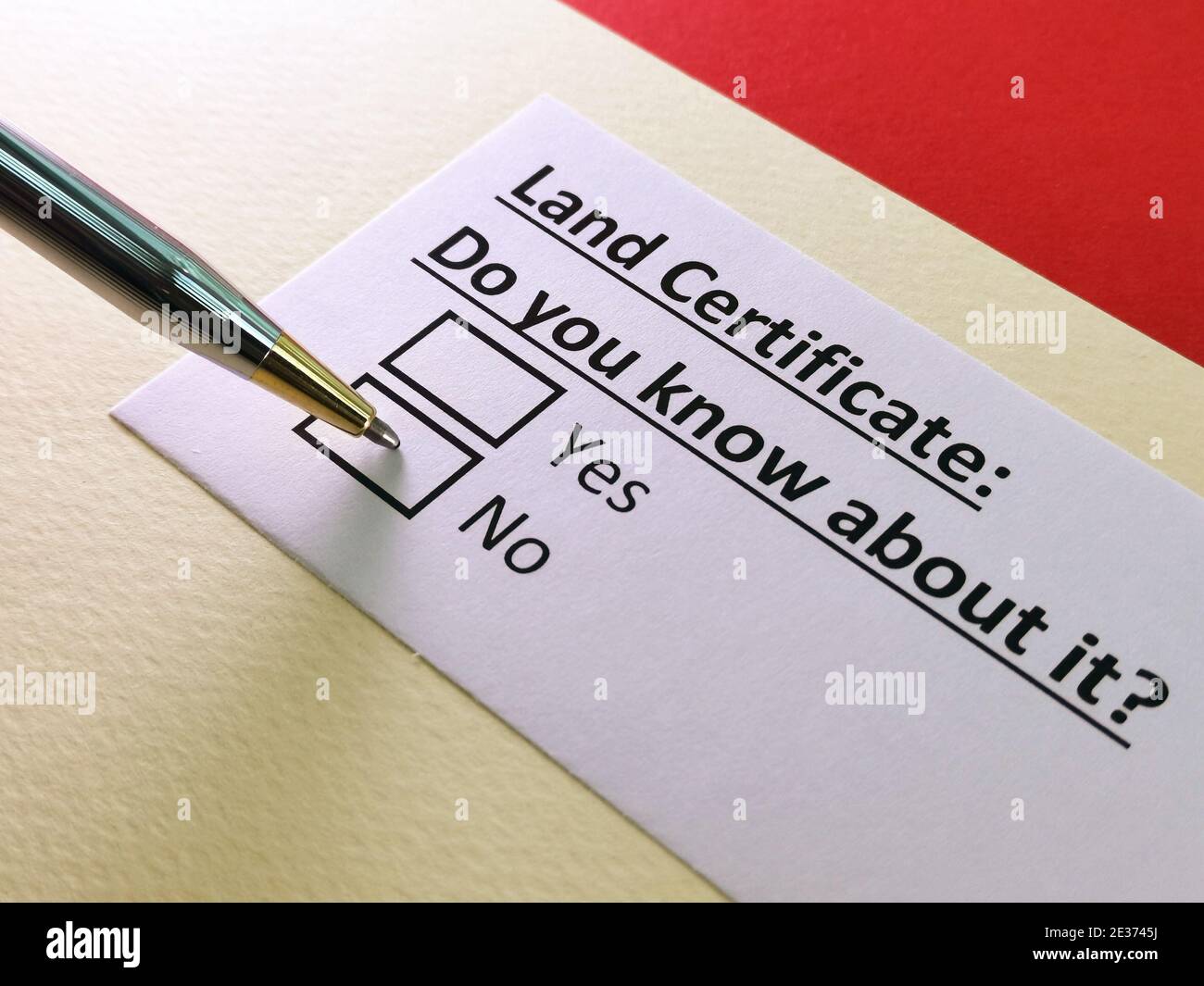 One person is answering question about land certificate Stock Photo - Alamy