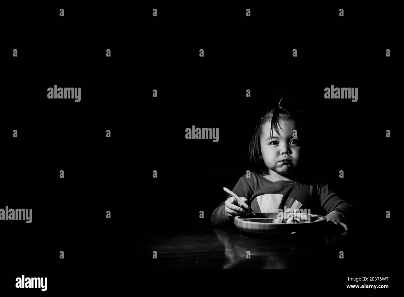 Sitting eating food Black and White Stock Photos & Images - Alamy