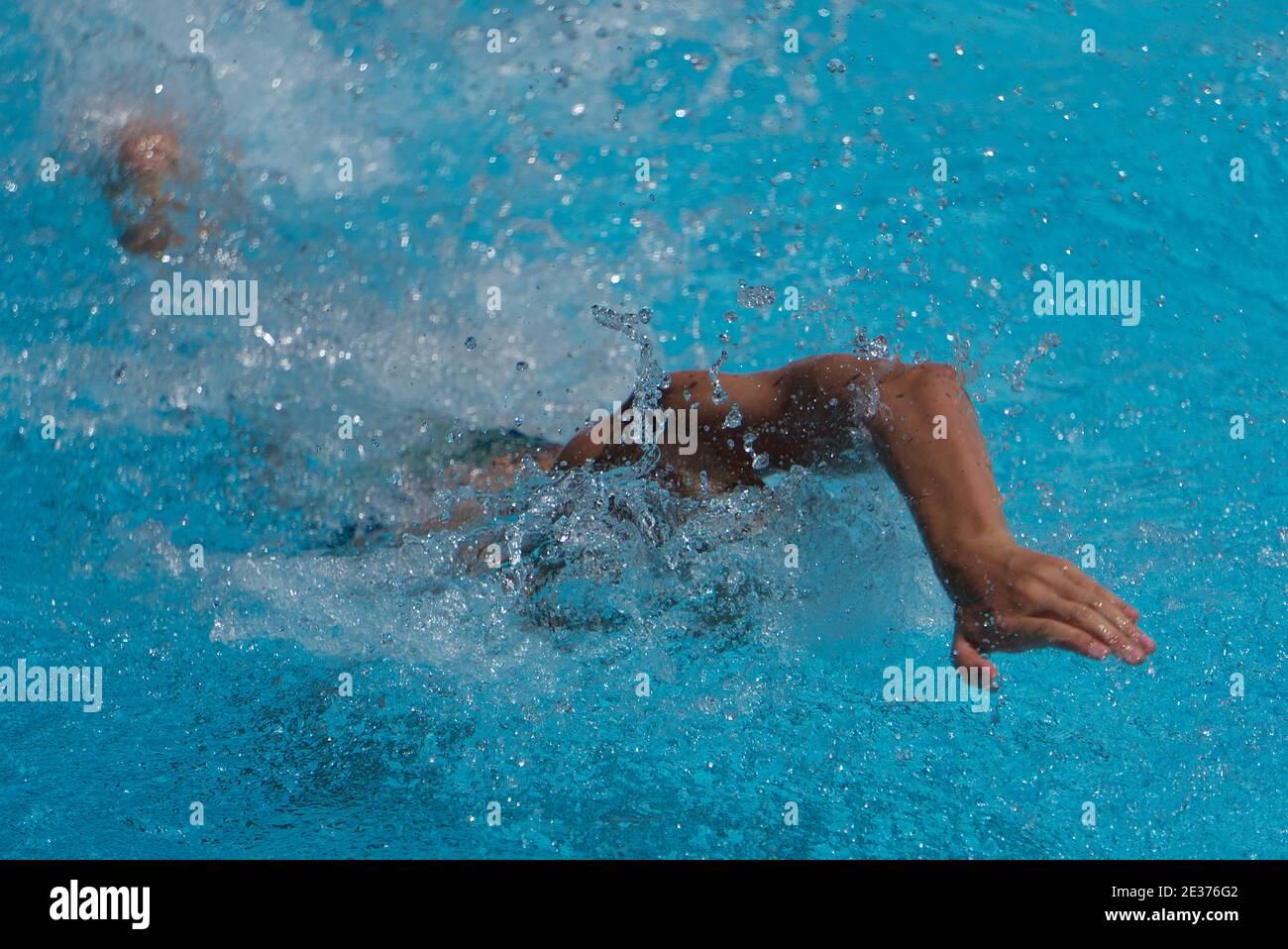 A high angle view of a swimmer swimming in the pool during a ...