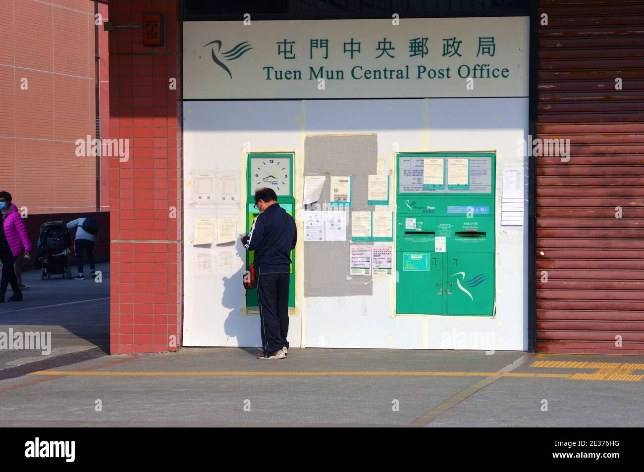Man purchasing stamps at Tuen Mun Central Post Office, Tuen Mun, Hong ...