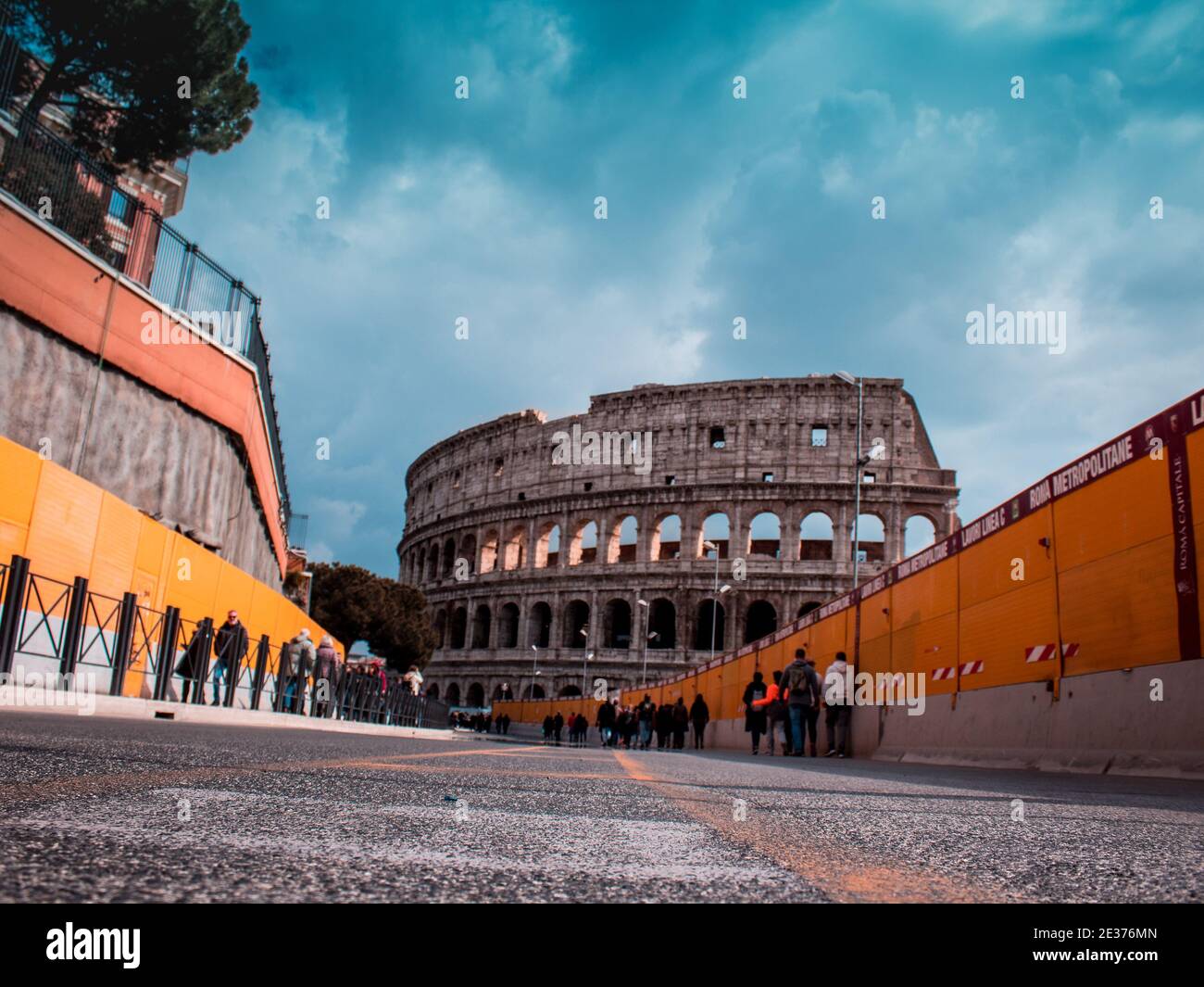 A view of the famous Coliseum in Rome, Italy under a cloudy sky ...