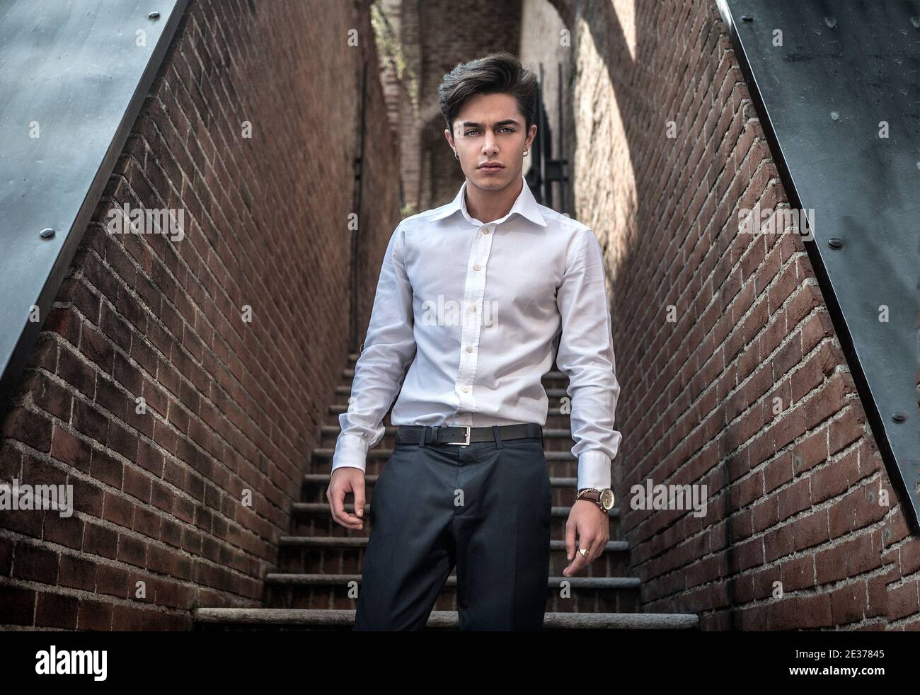 One handsome young man in city setting Stock Photo - Alamy