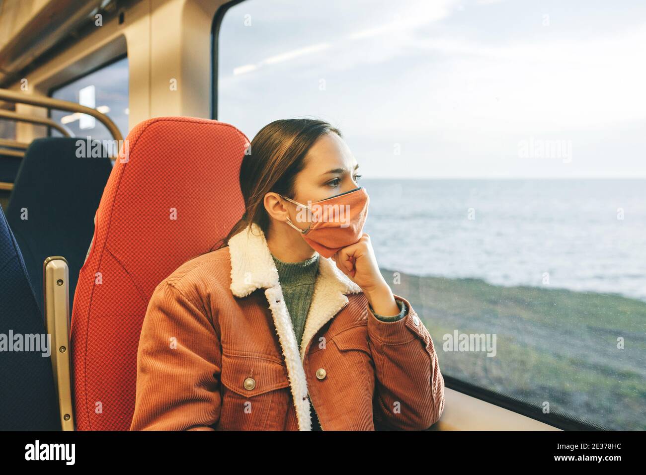 Woman on suburban train hi-res stock photography and images - Alamy