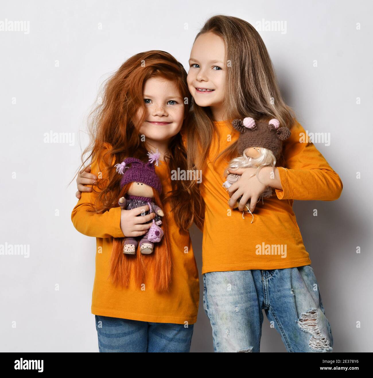 Child hugging her doll hi-res stock photography and images - Alamy