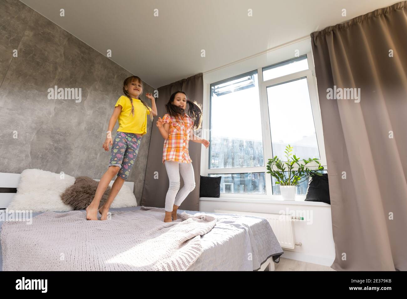 Creative cute girls, two sisters at home Stock Photo - Alamy
