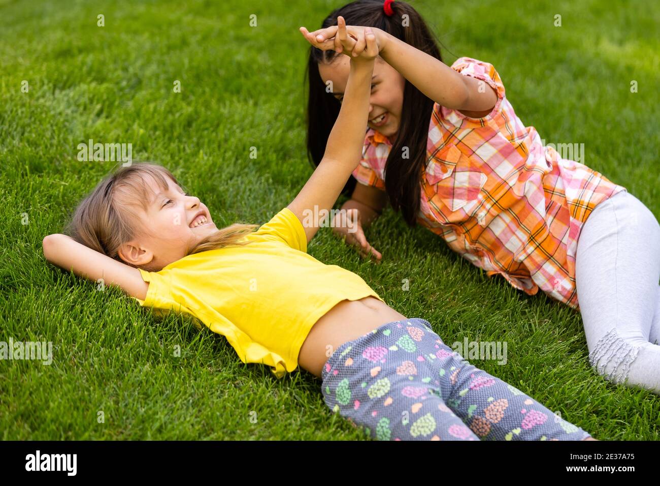 happy excited kids having fun together on playground Stock Photo - Alamy